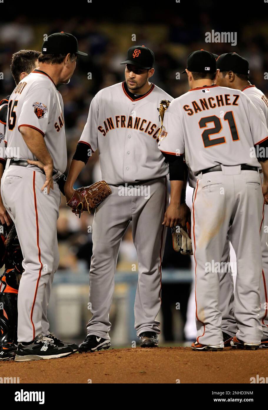 The Giants meet on the mound with pitcher Jonathan Sanchez (center ...