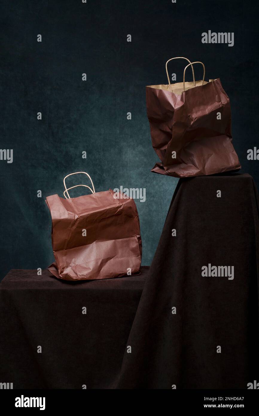 Still life with crumpled paper bags on the table Stock Photo - Alamy