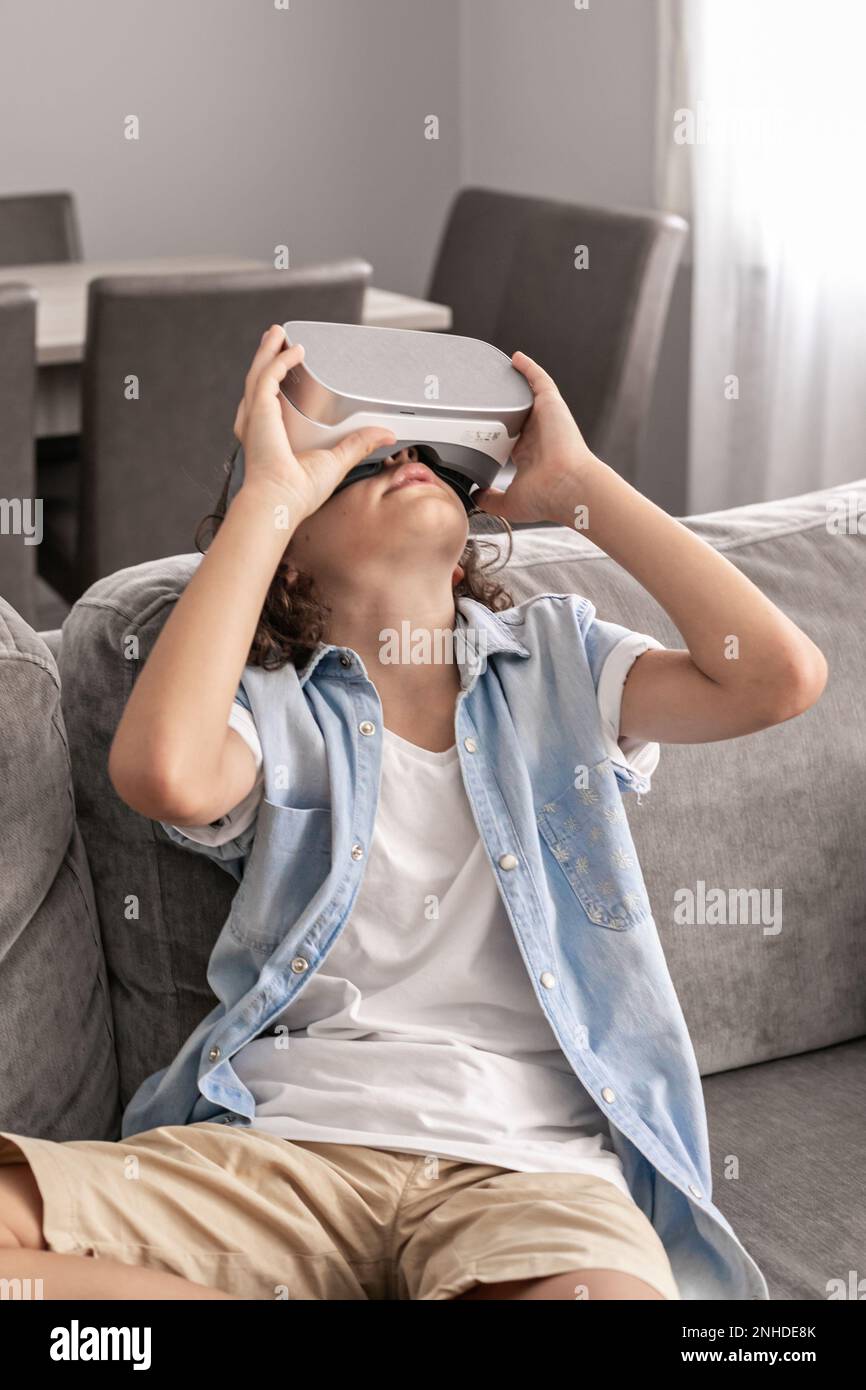 happy little boy child using virtual reality headset vr glasses ...