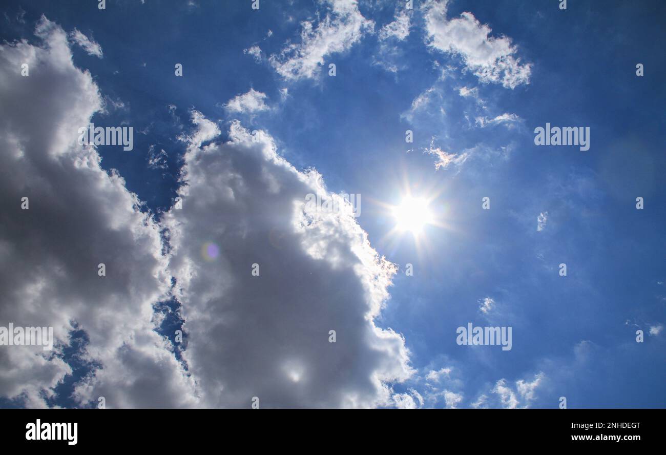 natural clouds blue sky sun ray light Stock Photo - Alamy