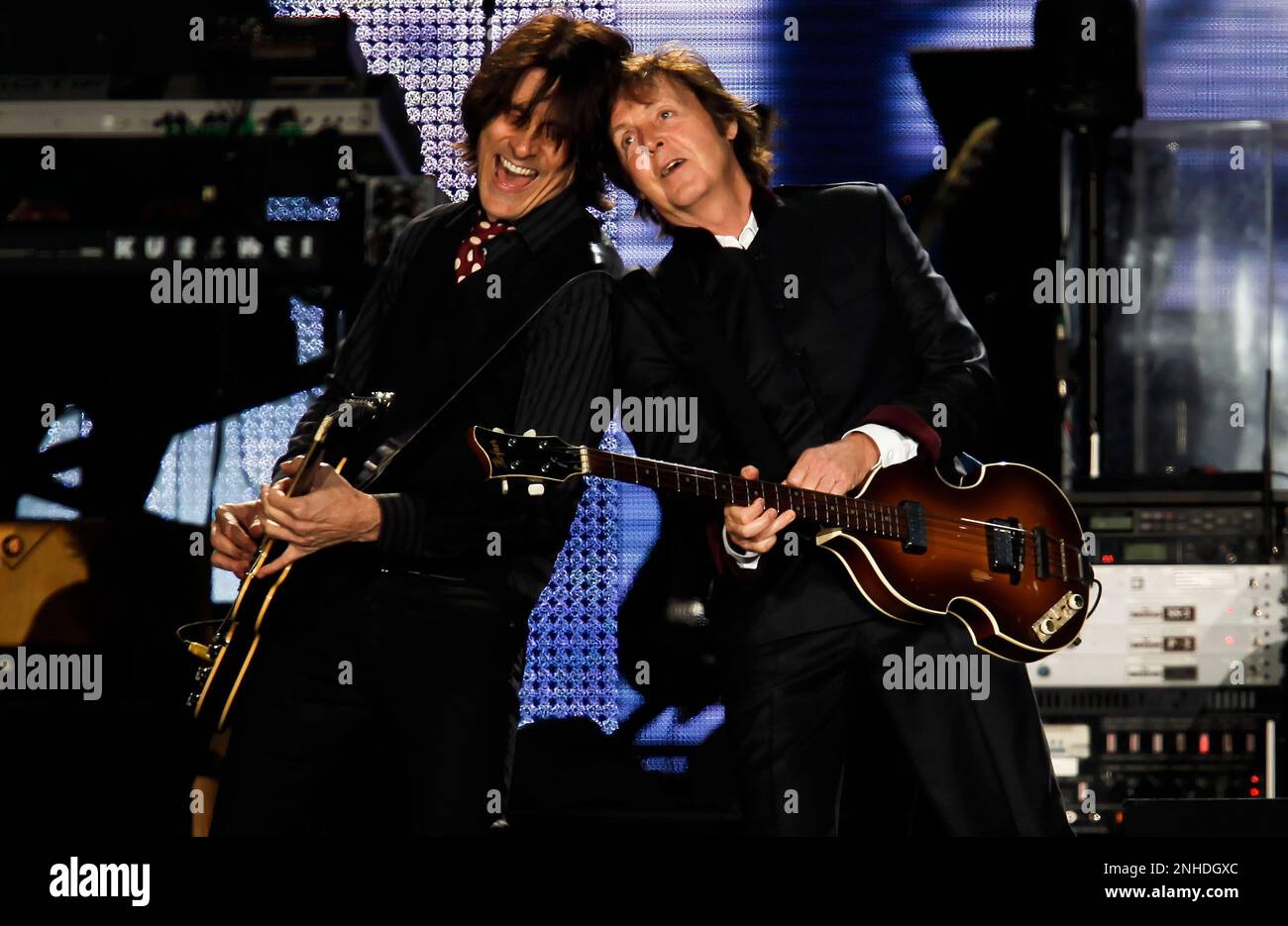Bandmate Rusty Anderson, (left) joins Sir Paul McCartney on stage as ...
