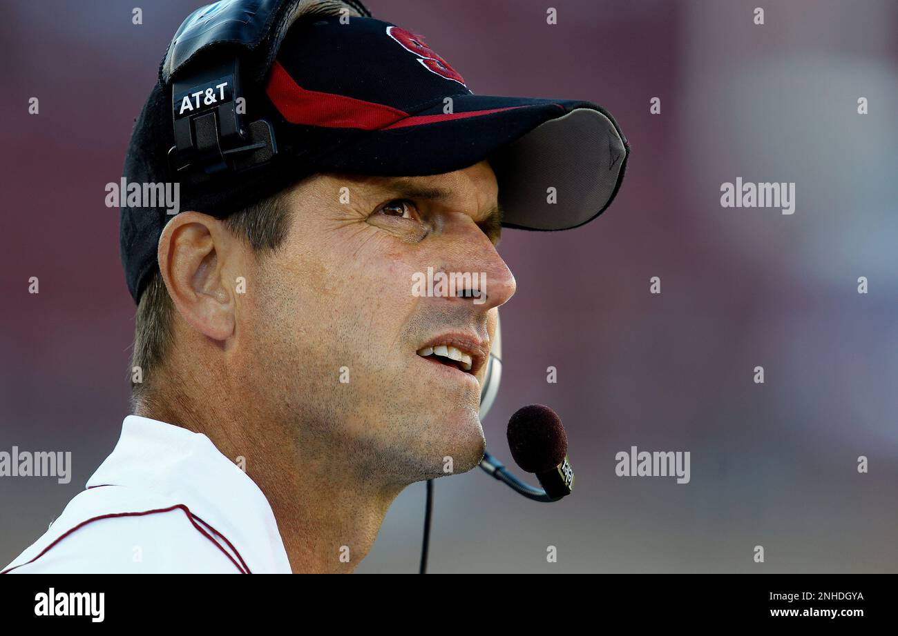 Stanford head coach Jim Harbaugh keeps an eye on things during the game ...
