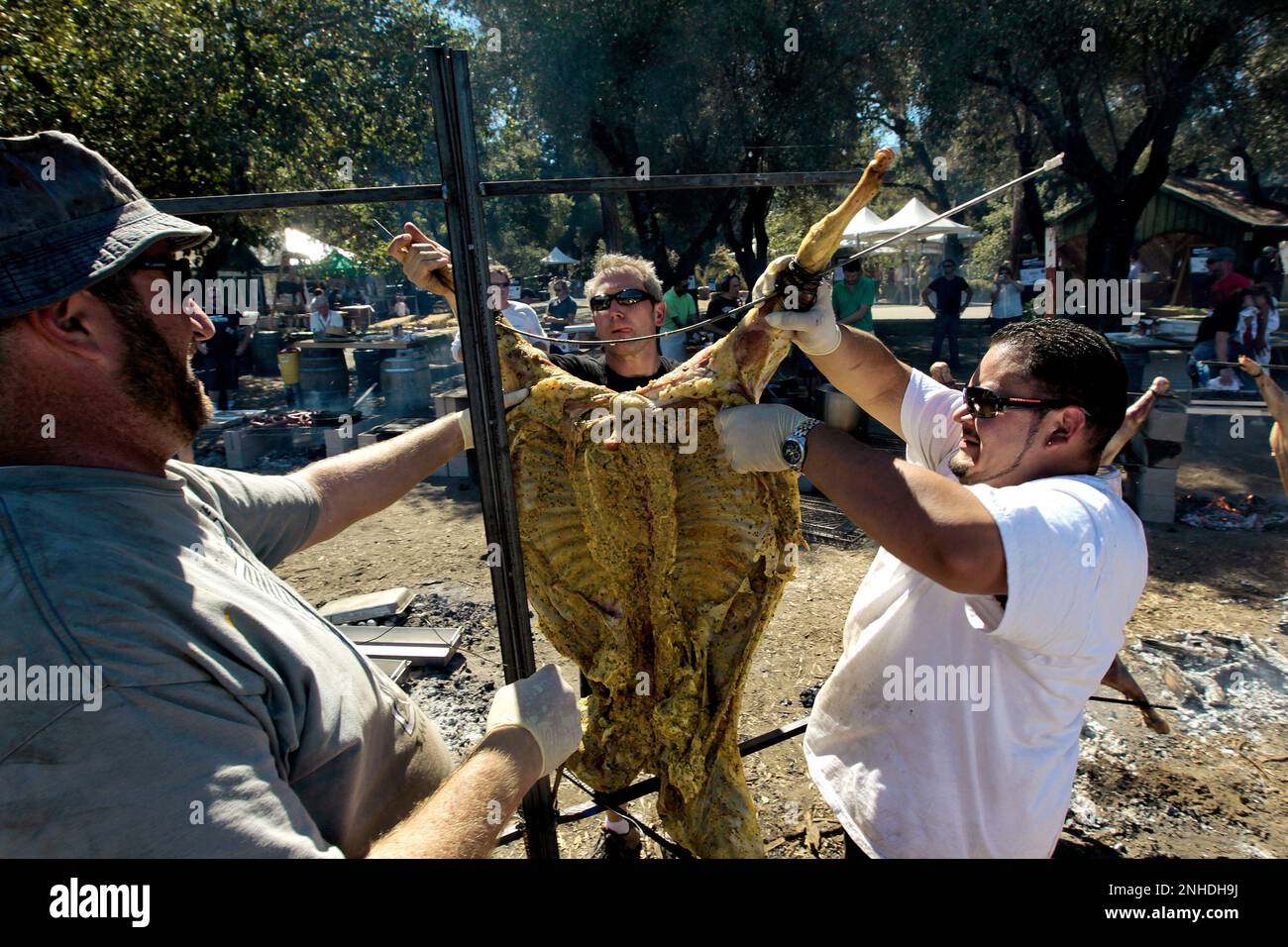 (left to right) John FInk, Mark Dommen and George Velazquez position a ...