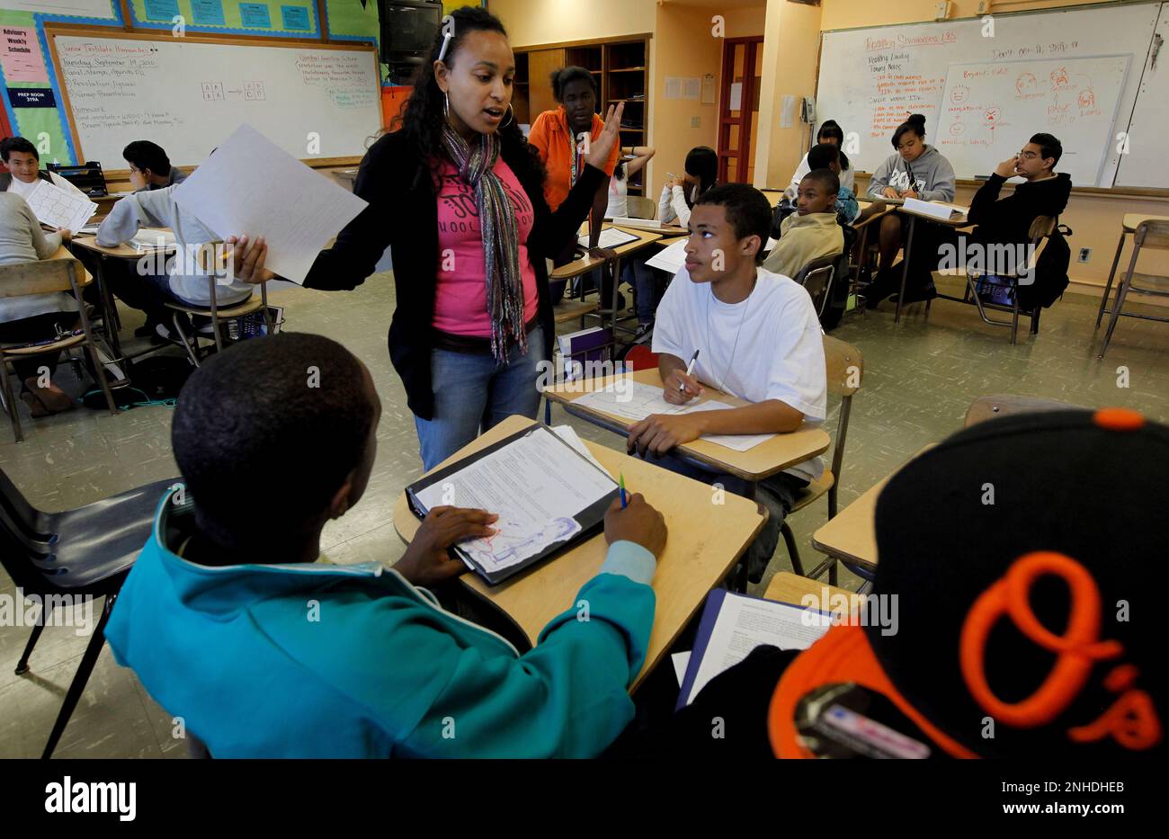 Humanities instructor, Katrina Traylor, works with 9th and 10th grade ...