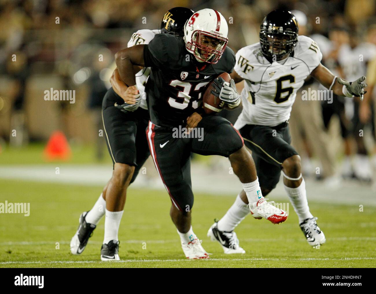 Stanford running back Stepfan Taylor, (33) drags defenders as he picks ...