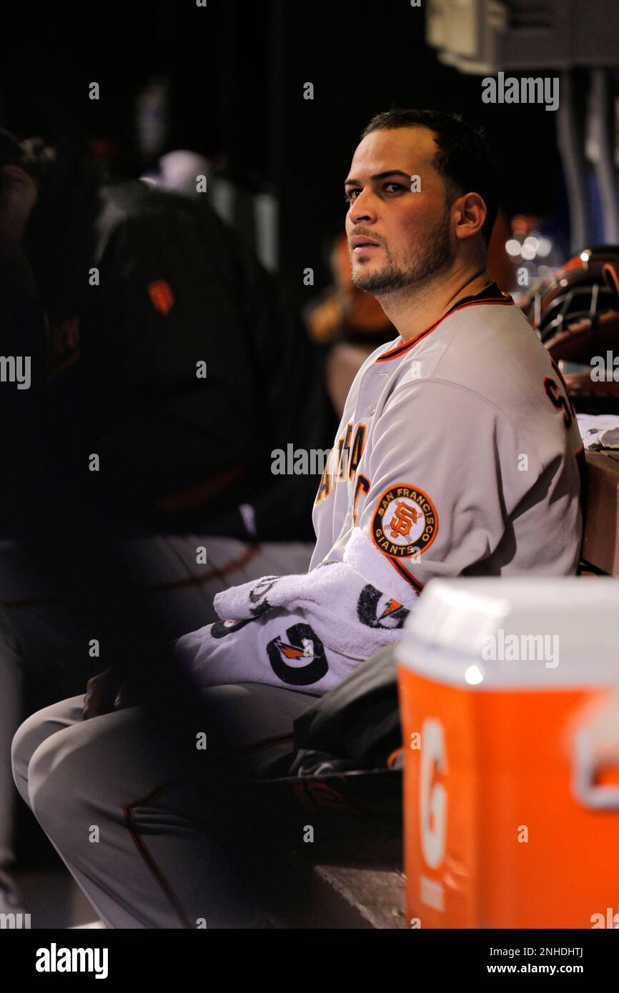 Giants starting pitcher Jonathan Sanchez, sots in the dugout after ...