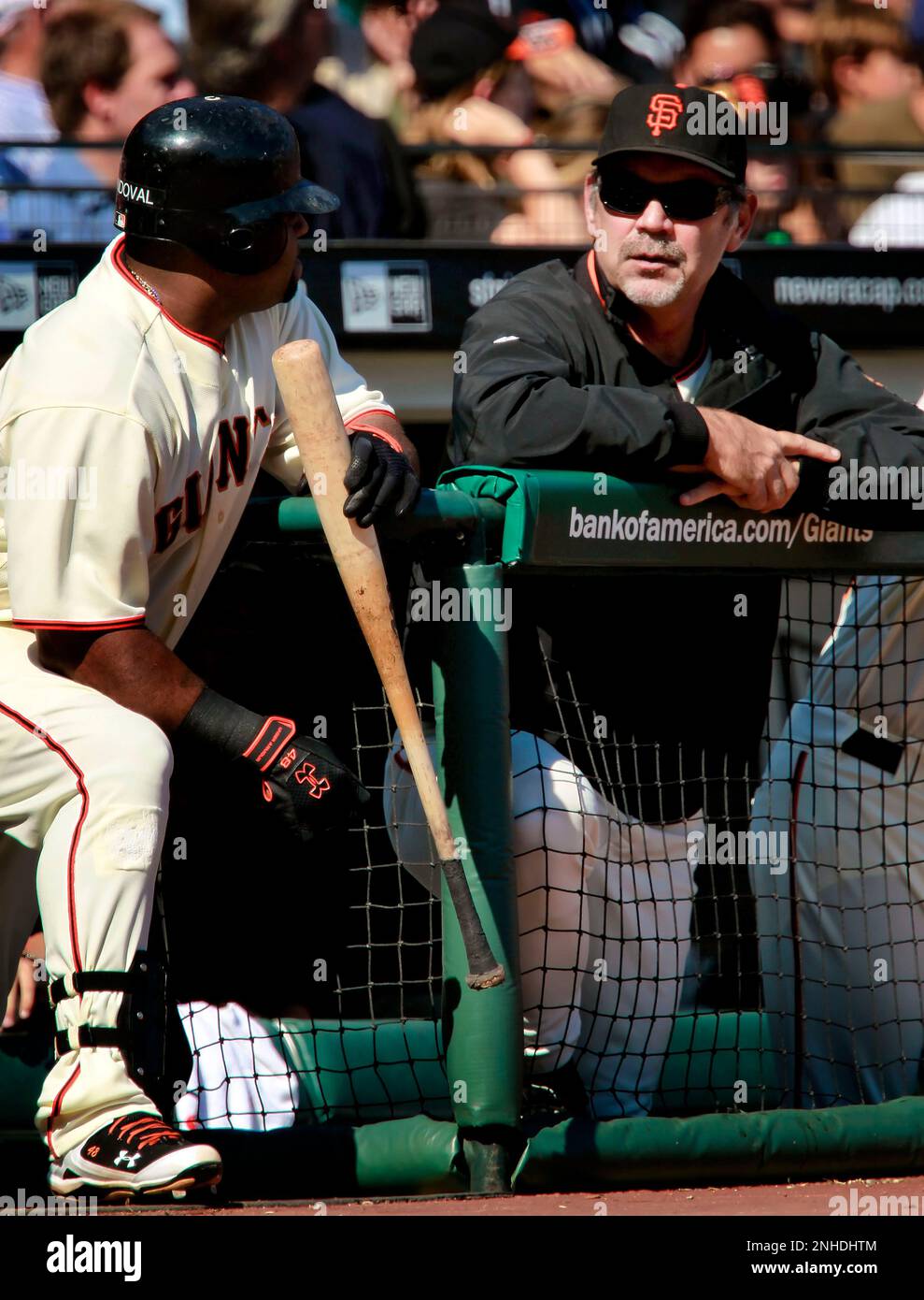 Giants Pablo Sandoval has a word with manager Bruce Bochy as he waits ...