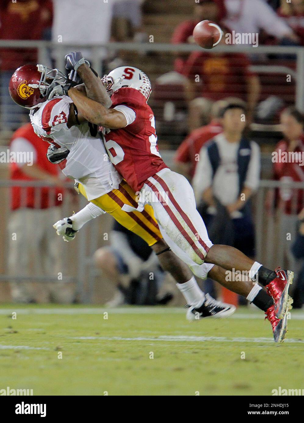USC's Ronald Johnson has the ball knocked away by Stanford defender ...