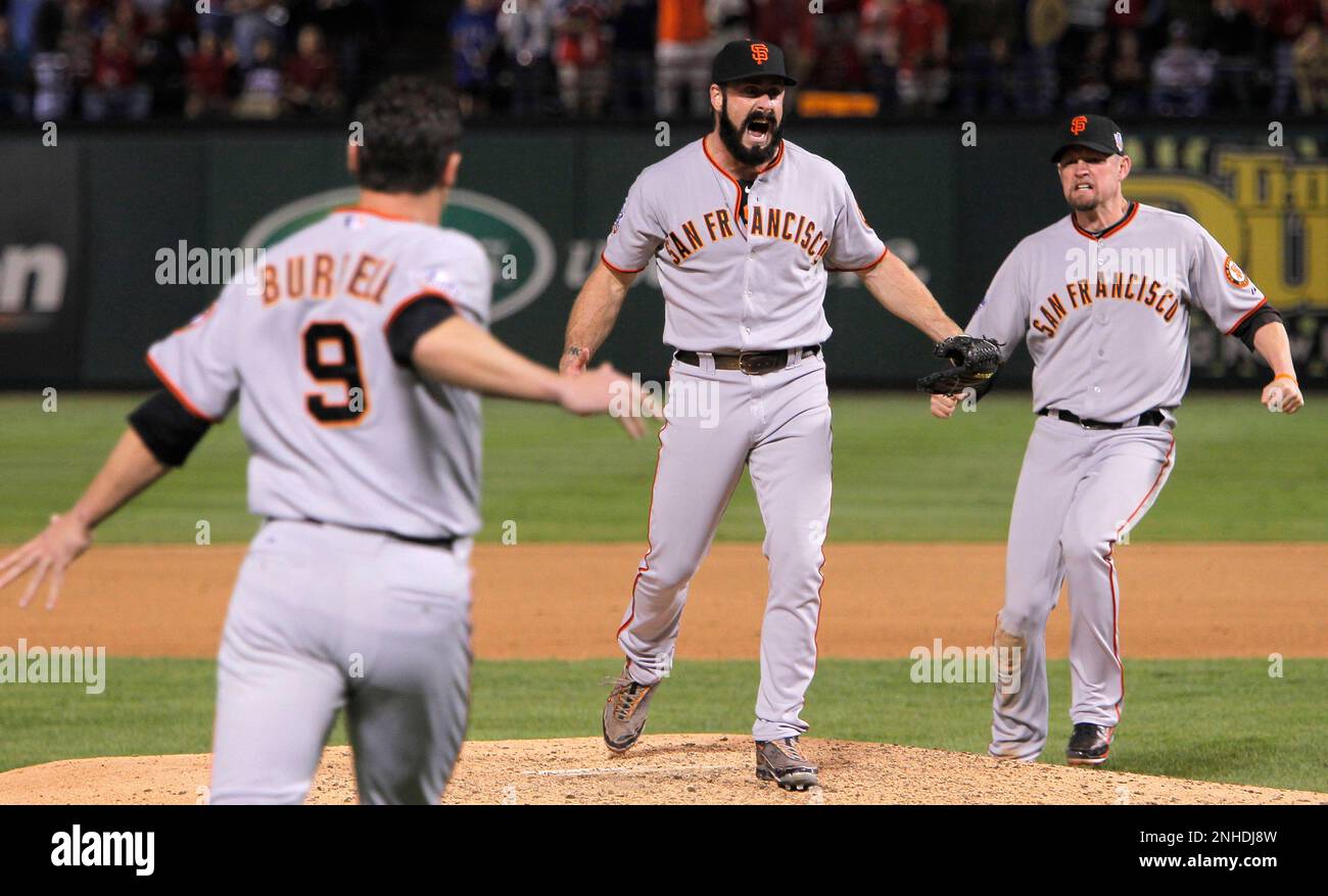 Pat Burrell, Brian Wilson and Aubrey Huff begin the celebration as the ...