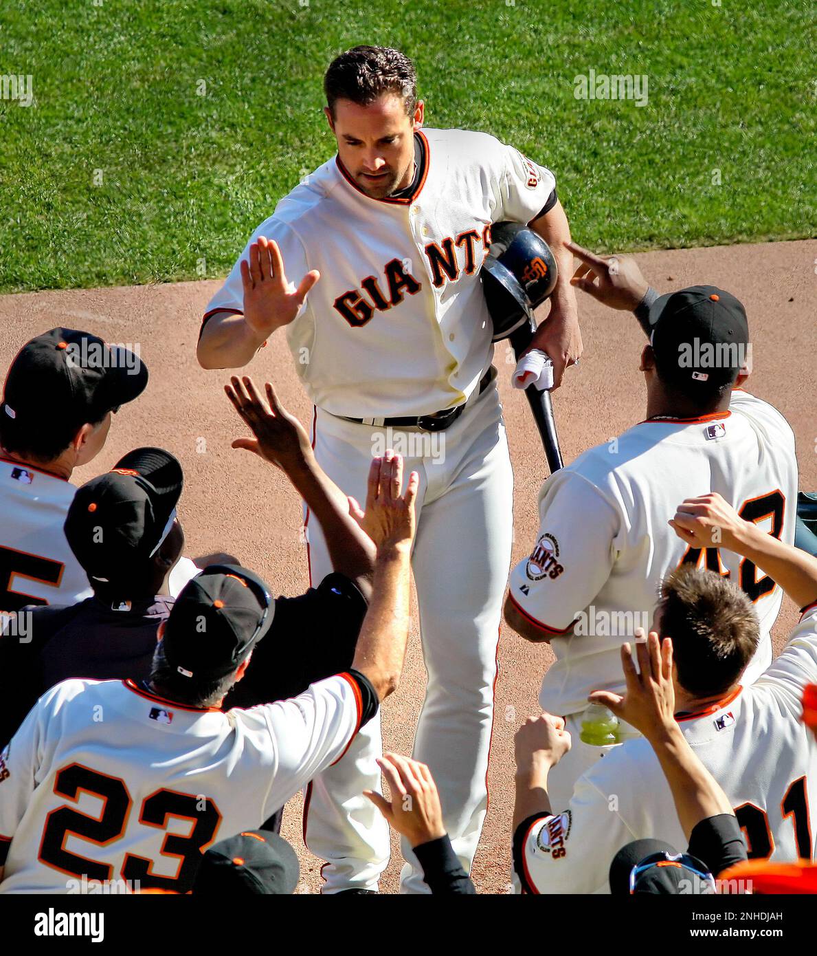 Giants Pat Burrell celebrates his run scored on an Aubrey Huff single ...
