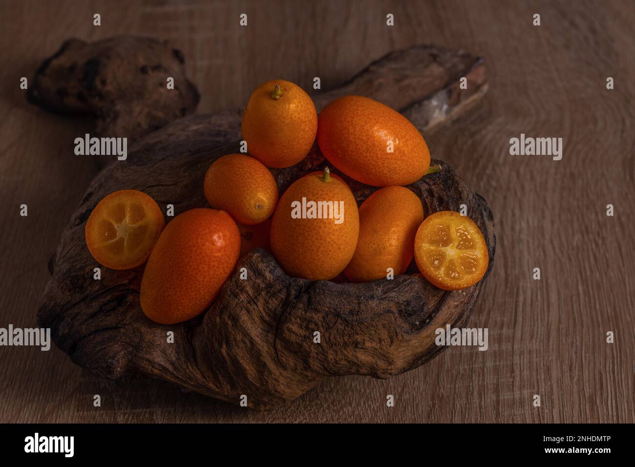Close-up of small Chinese oranges (Citrus sinensis) or Kumquat on a ...