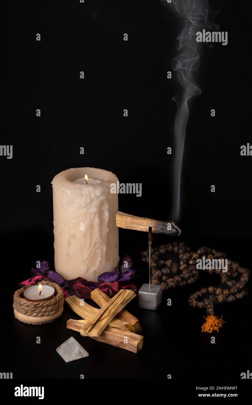 Zen image of smoking palo santo, holy stick with candles and japa-mala ...