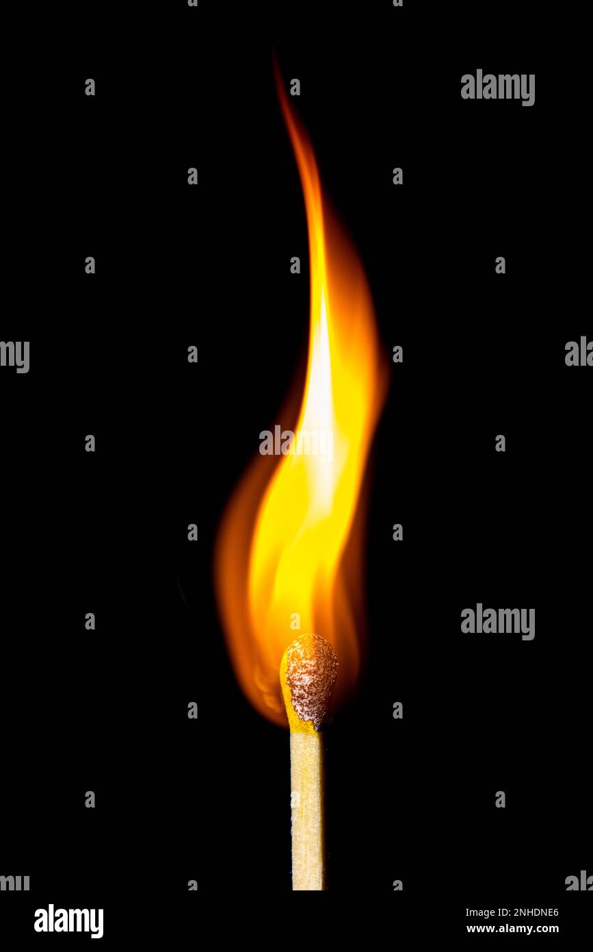 Burning match, close-up, black background Stock Photo - Alamy