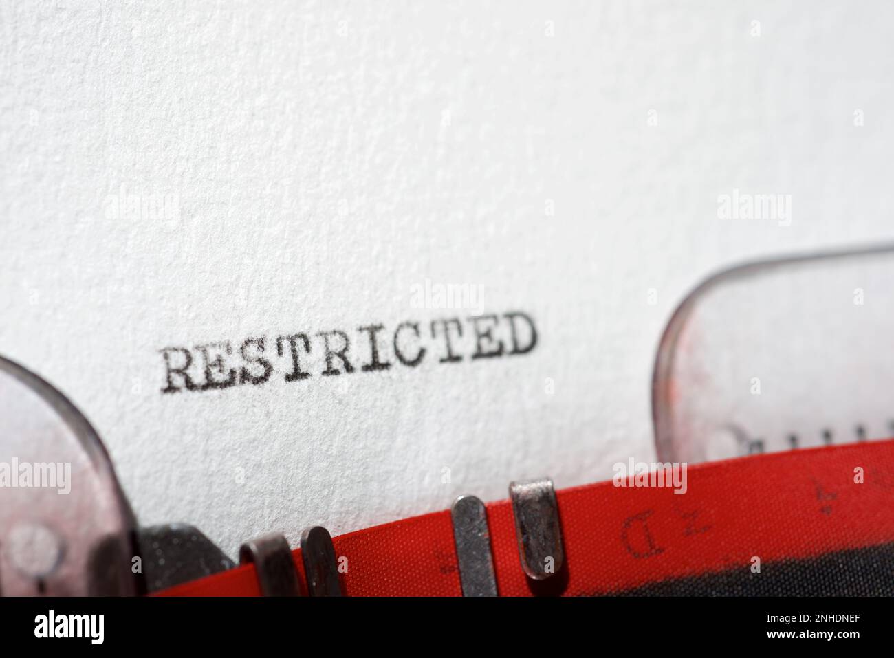 Restricted word written with a typewriter Stock Photo - Alamy