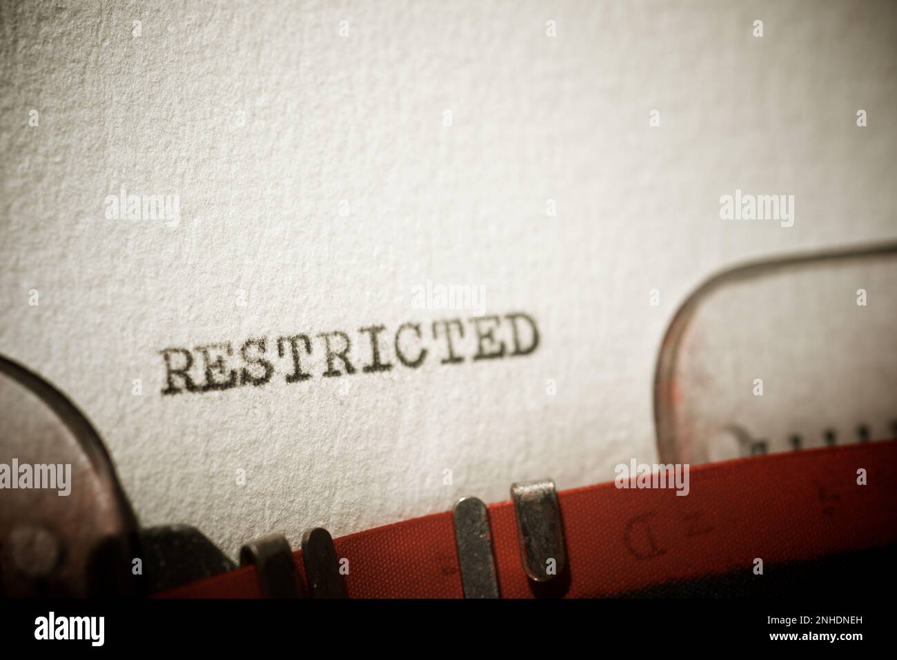 Restricted word written with a typewriter Stock Photo - Alamy