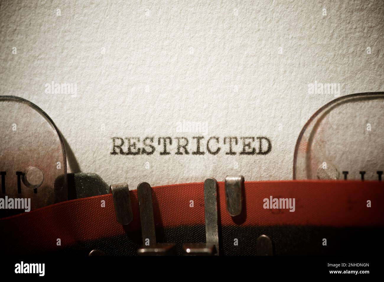 Restricted word written with a typewriter Stock Photo - Alamy