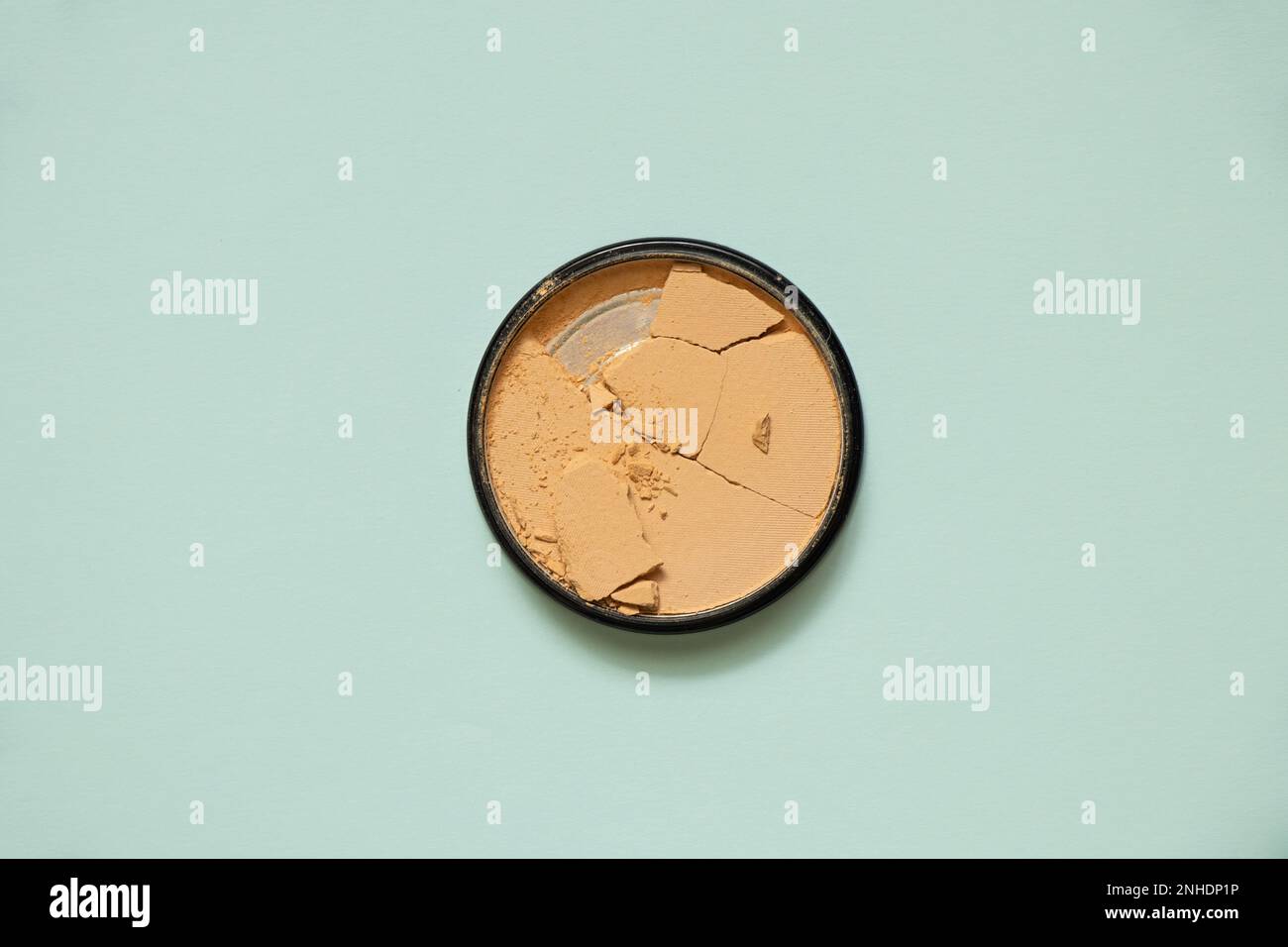 powder broken in package on isolated blue background close up Stock ...