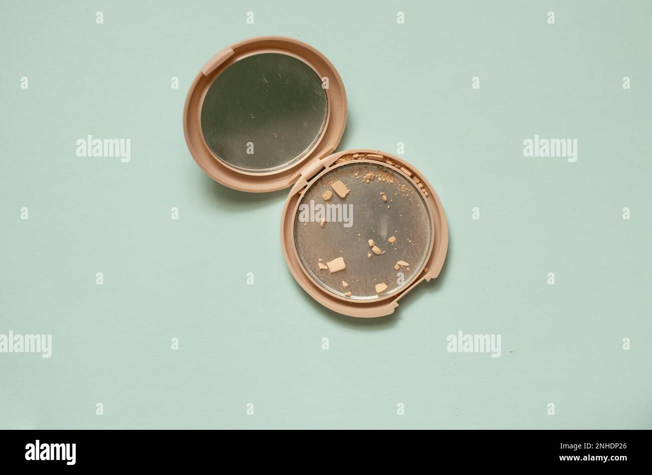 powder broken in package on isolated blue background close up Stock ...