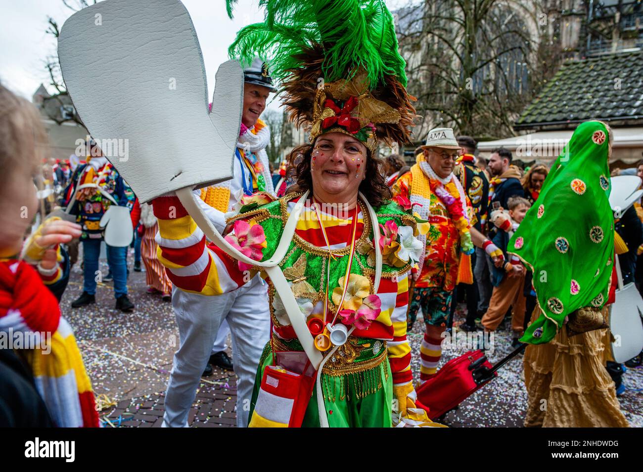 A woman seen asking high five with her big hand during the parade. The ...