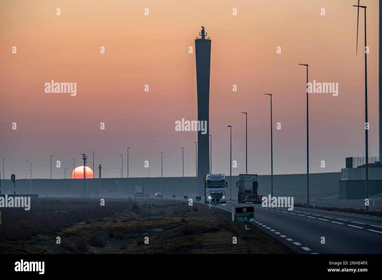 Truck on the road to Euromax Terminal Rotterdam, ENECO wind farm on the ...