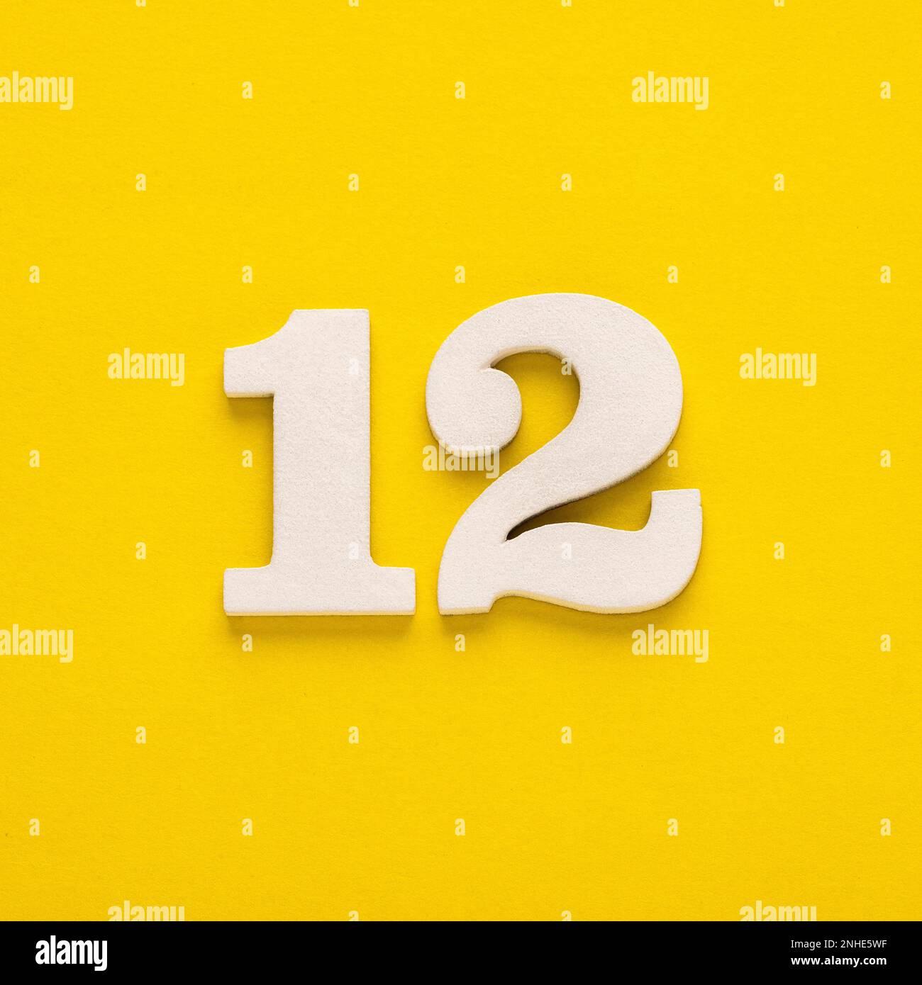 Number 12 on a yellow background - Two-digit number in white Stock ...