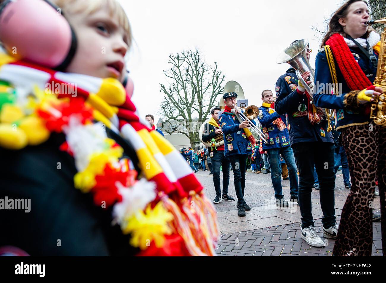 A little girl seen watching one of the music bands parading. The city ...