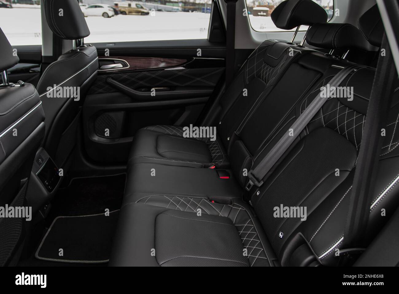 Modern car interior. Clean rear seats with the belts. Three rear seats ...
