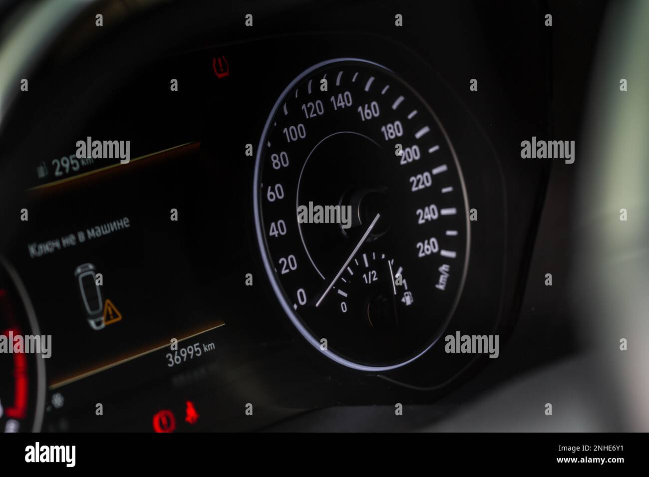 Close up of a car speedometer. Car speedometer guage. Translation "Key ...