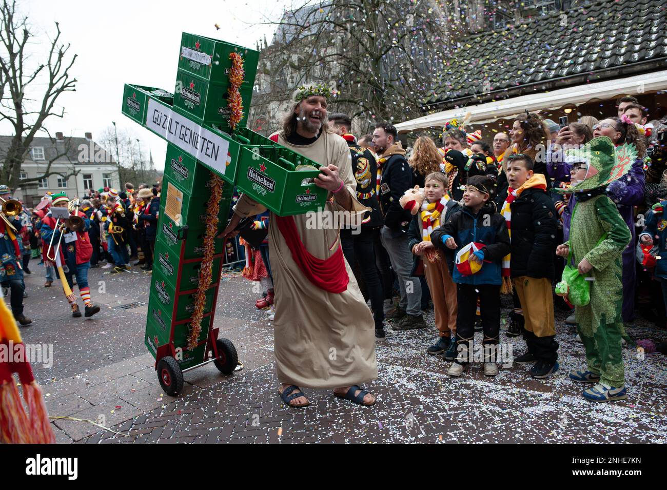 A man seen dressed as Jesus Christ while carrying a cross made of beer ...
