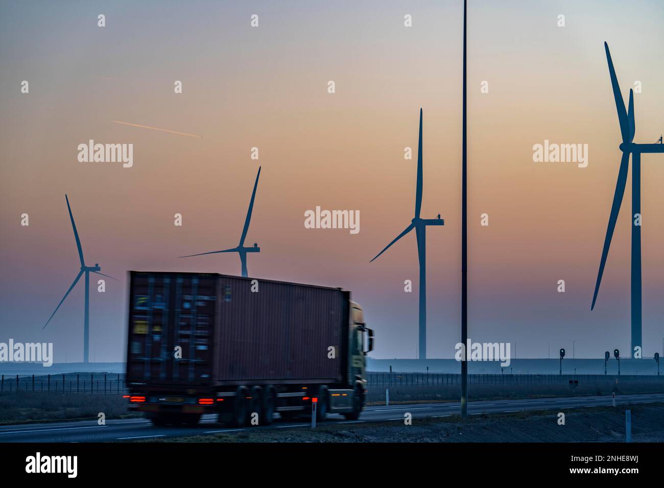 Truck on the road to Euromax Terminal Rotterdam, ENECO wind farm on the ...