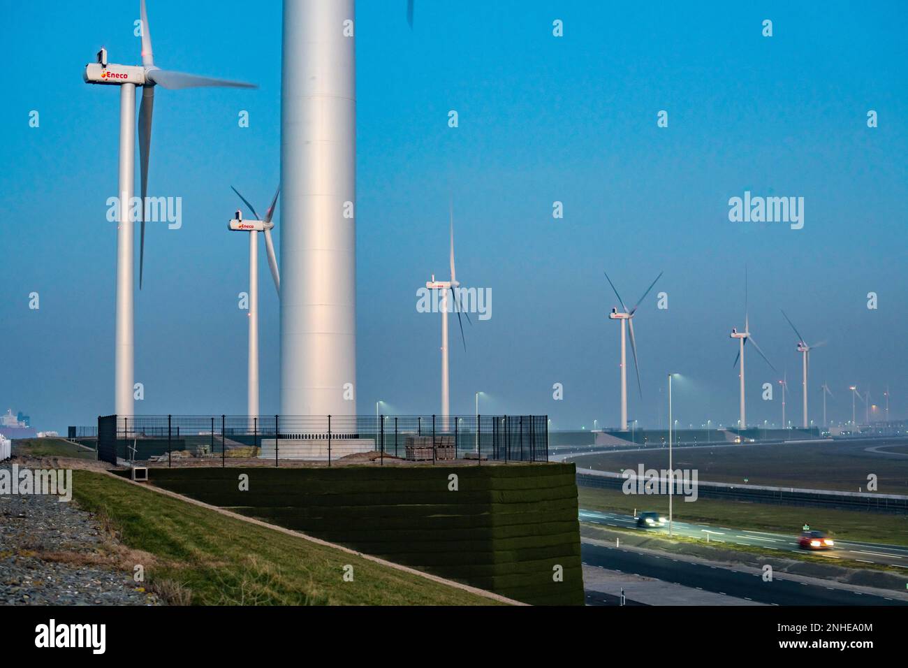 Truck on the road to Euromax Terminal Rotterdam, ENECO wind farm on the ...