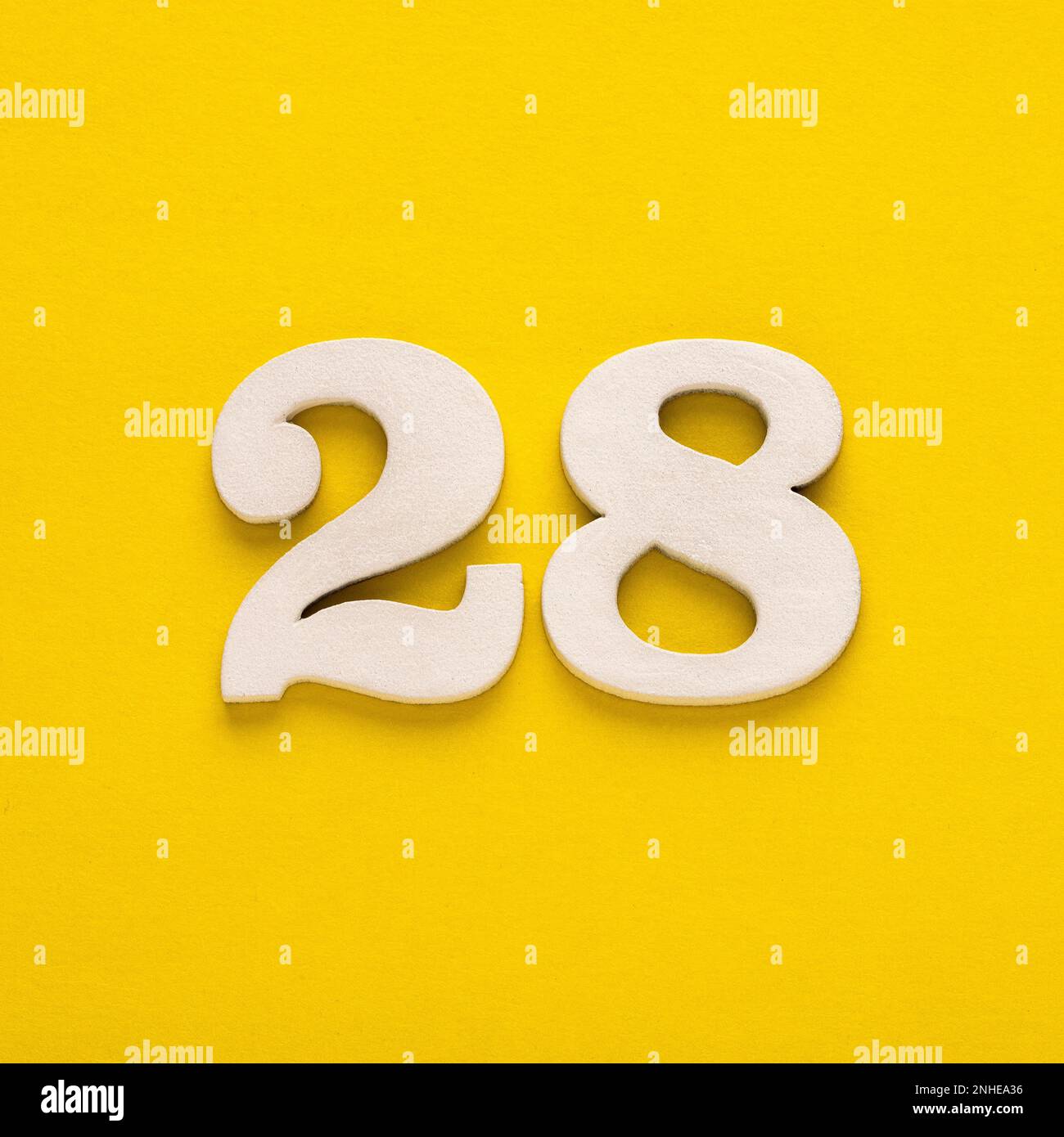 Number 28 on a yellow background - Two-digit number in white Stock ...