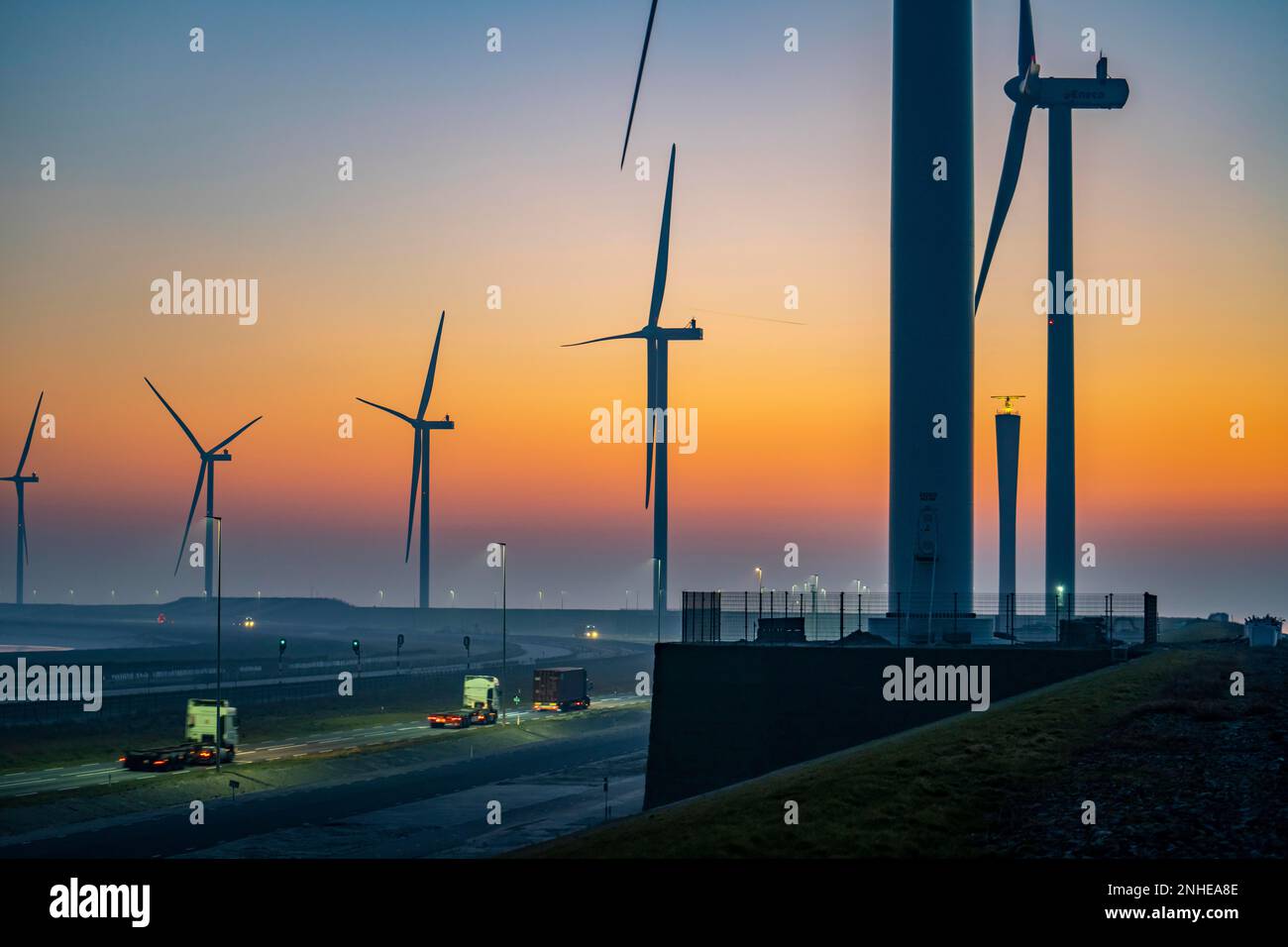 Truck on the road to Euromax Terminal Rotterdam, ENECO wind farm on the ...