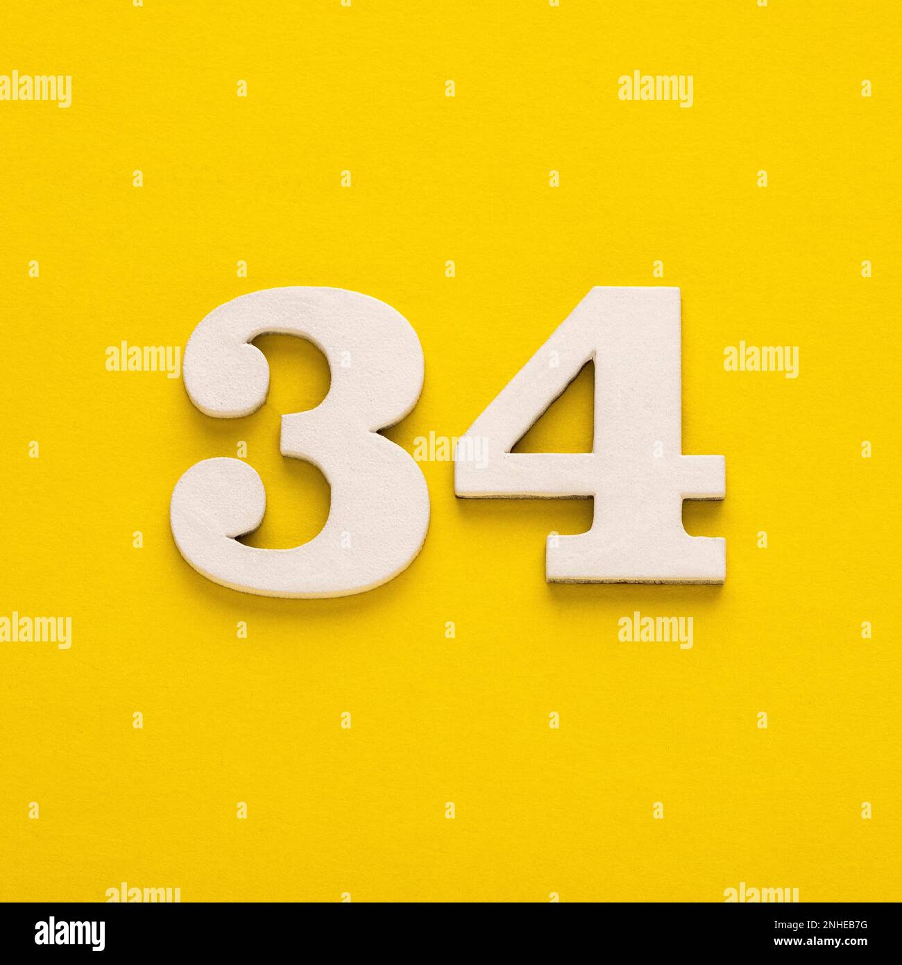 Number 34 on a yellow background - Two-digit number in white Stock ...