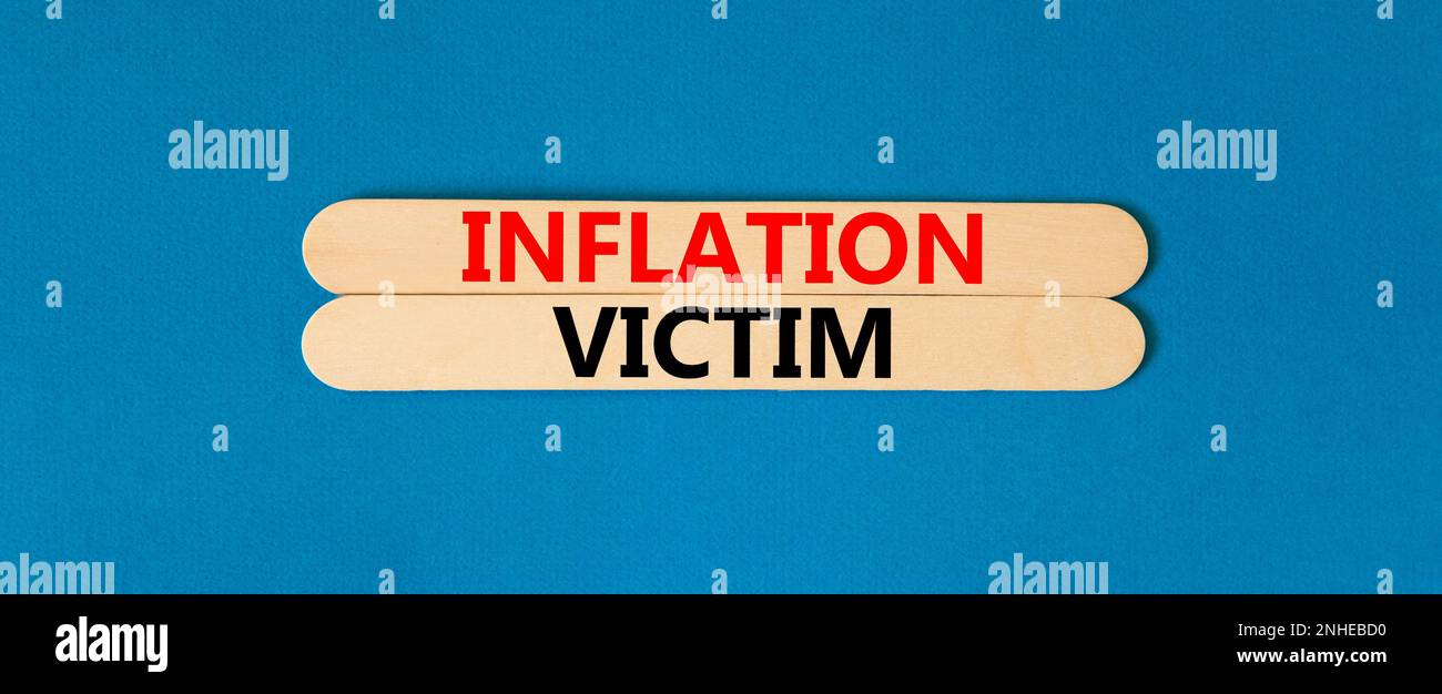 Inflation victim symbol. Concept words Inflation victim on wooden ...