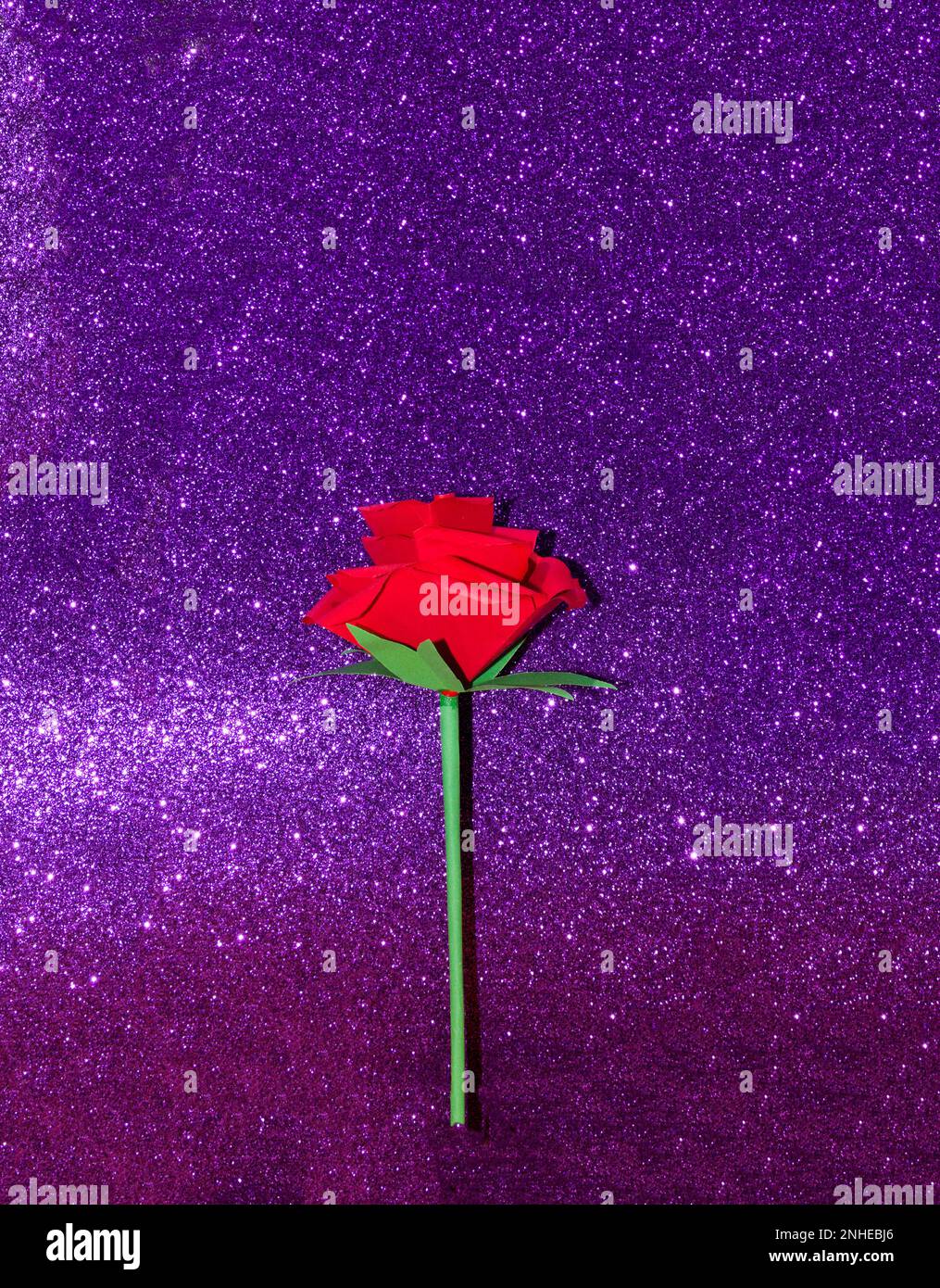 red craft rose on the purple glitter background, creative art design ...