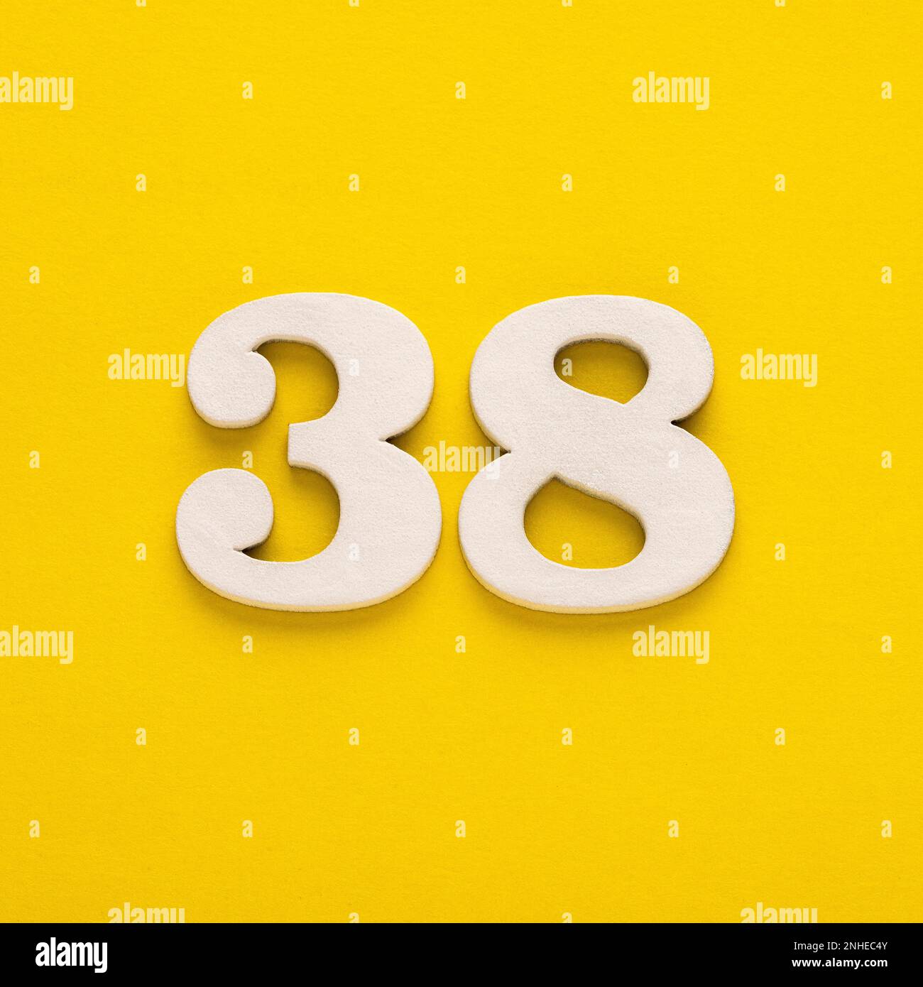 Number 38 on a yellow background - Two-digit number in white Stock ...