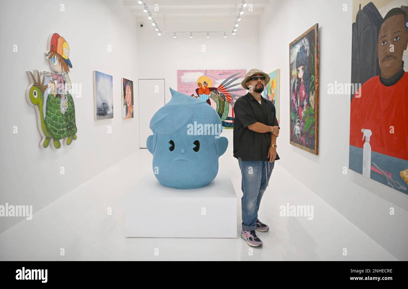 Kevin Poon, founder of WOAW Gallery at his Singapore gallery with some ...