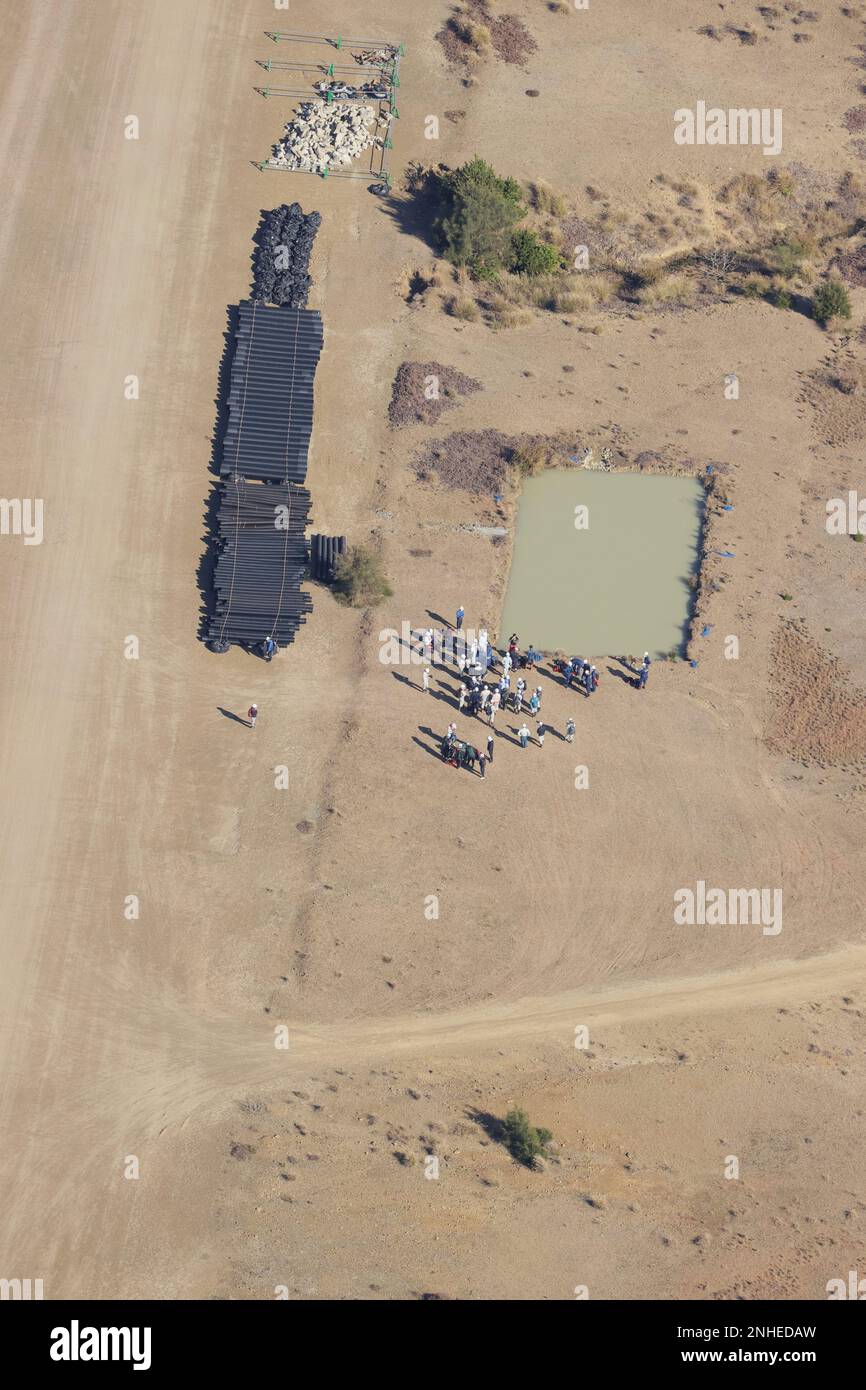 Workers are at Mageshima Island in Iriomote City, Kagoshima Prefecture ...