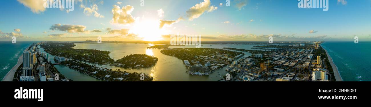 Aerial panorama beautiful Miami Beach sunset. View of islands water and ...