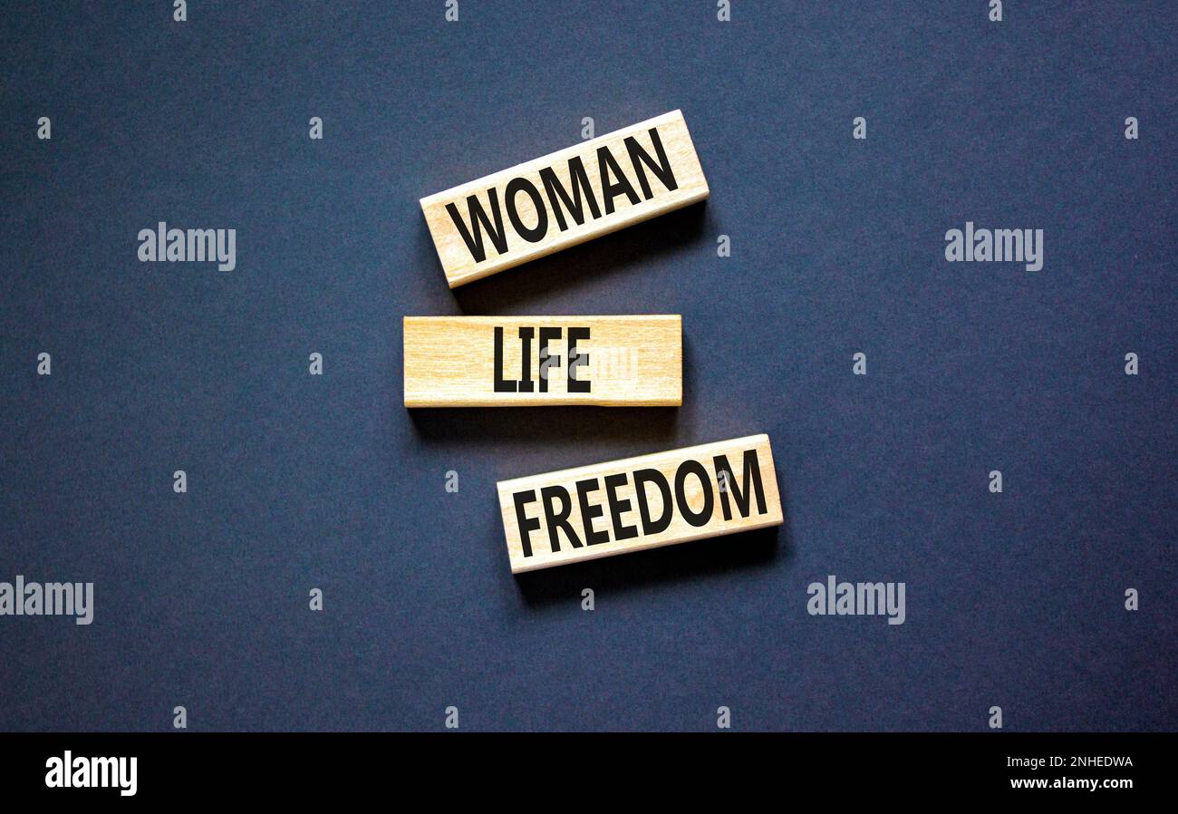 Woman life freedom symbol. Concept words Woman Life Freedom on wooden ...