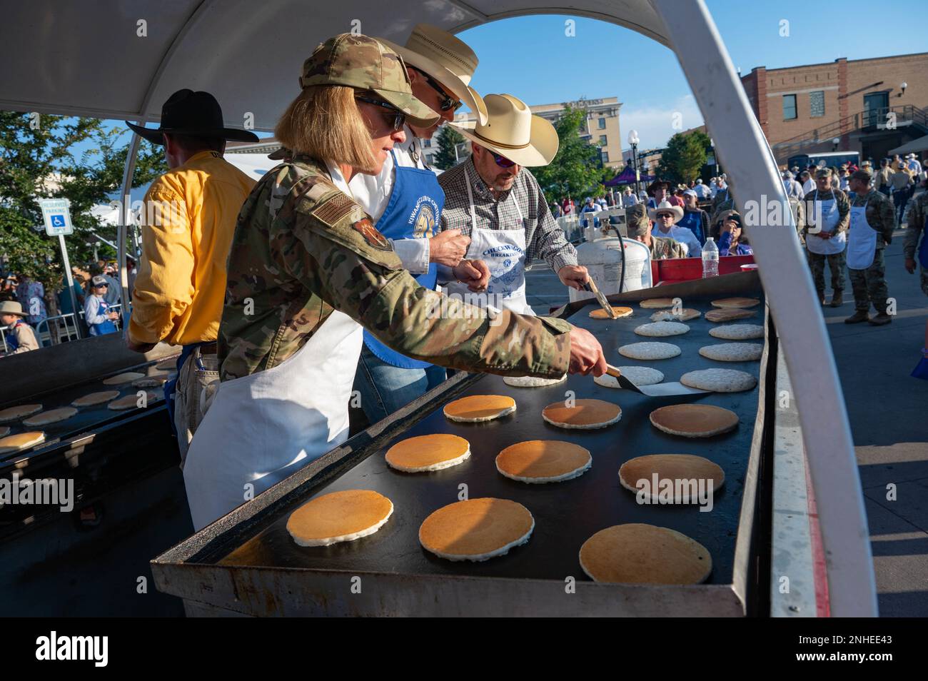 Col. Catherine Barrington, 90th Missile Wing Commander, grills pancakes ...
