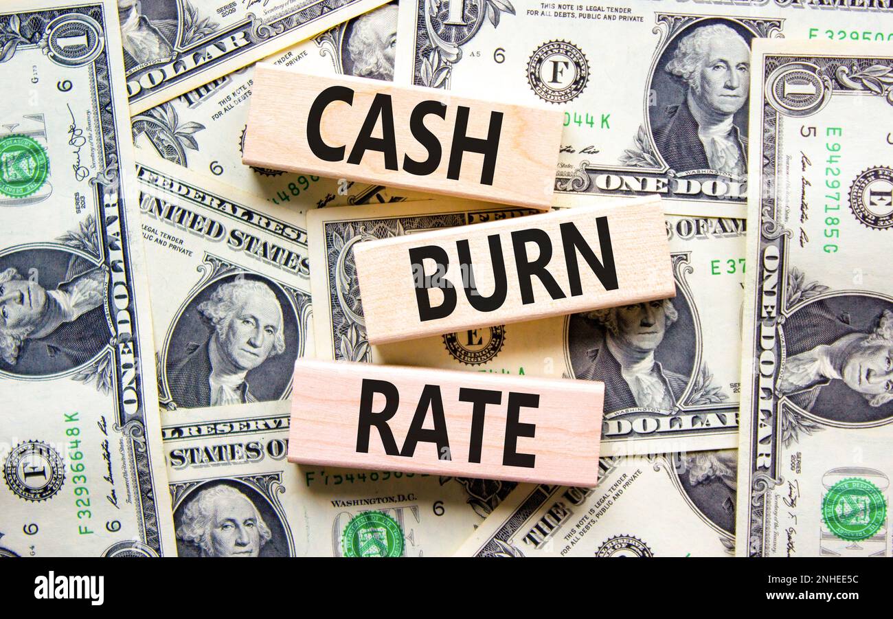 Cash burn rate symbol. Concept words Cash burn rate on wooden blocks on ...
