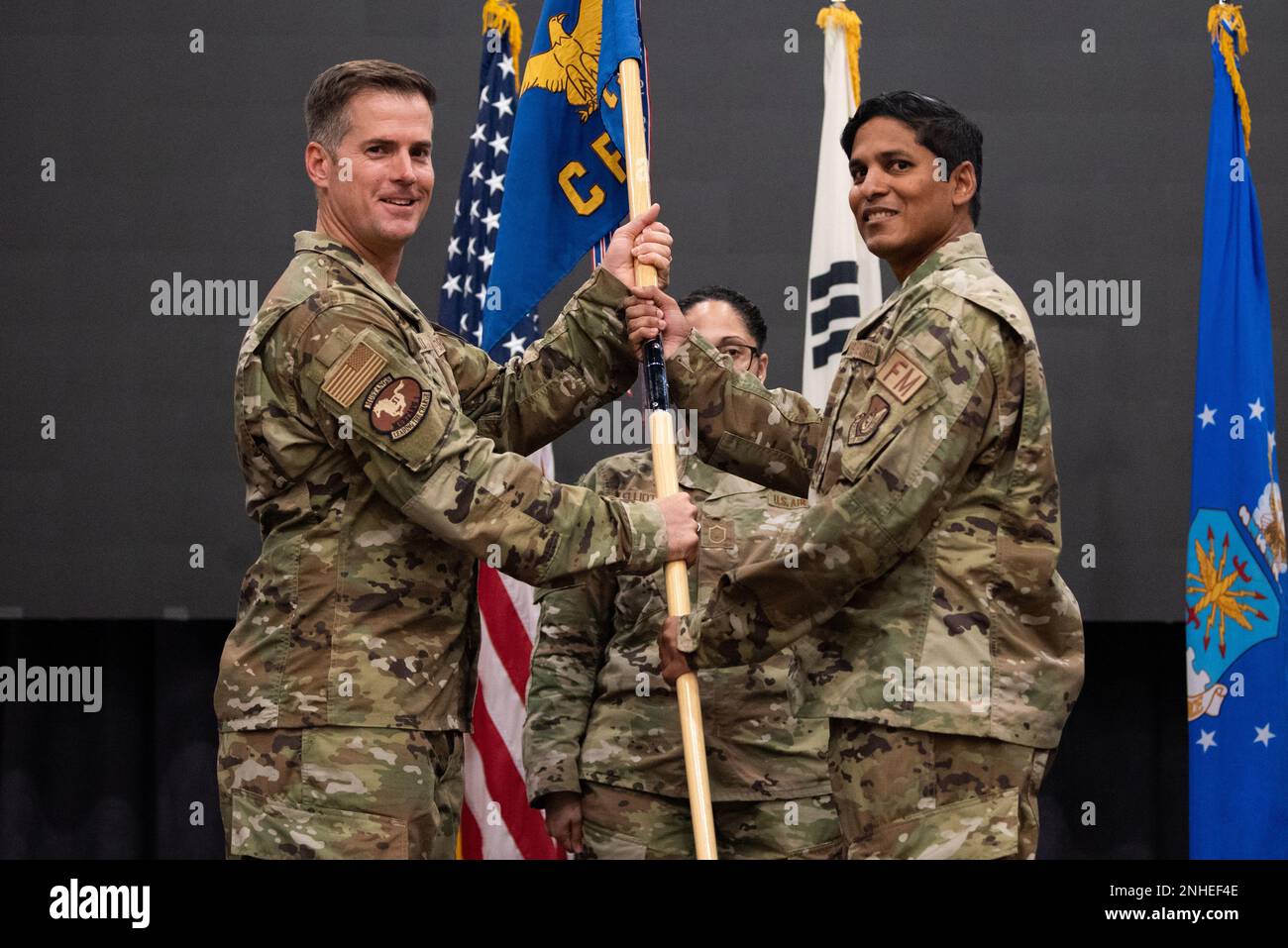 Col. Joshua Wood, 51st Fighter Wing commander, passes the guidon to Maj ...
