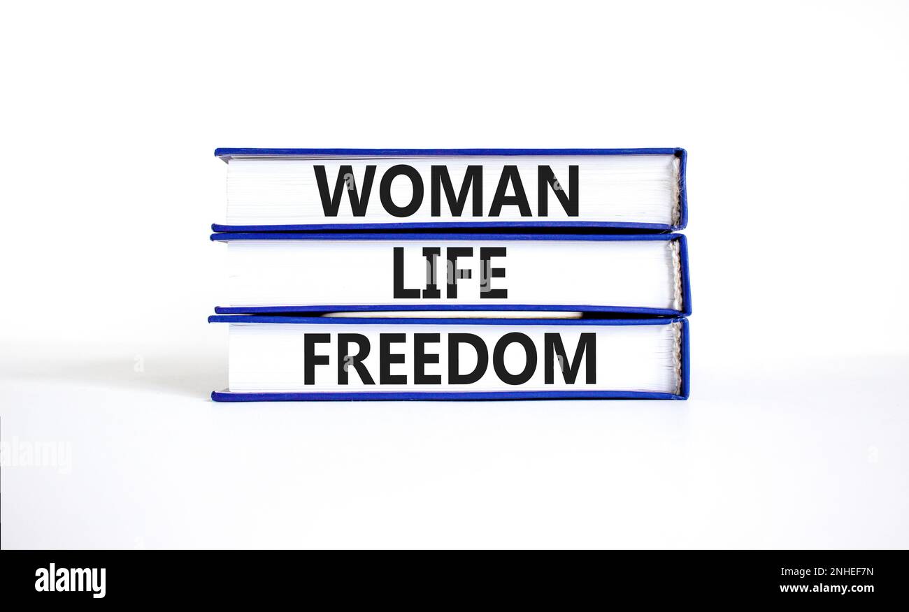 Woman life freedom symbol. Concept words Woman Life Freedom on books on ...