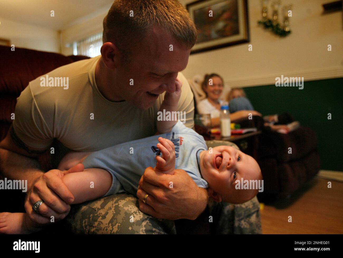 thirdtour14 225 mac.jpg Staff Sgt. Rob Puckett with his 6 month old son ...