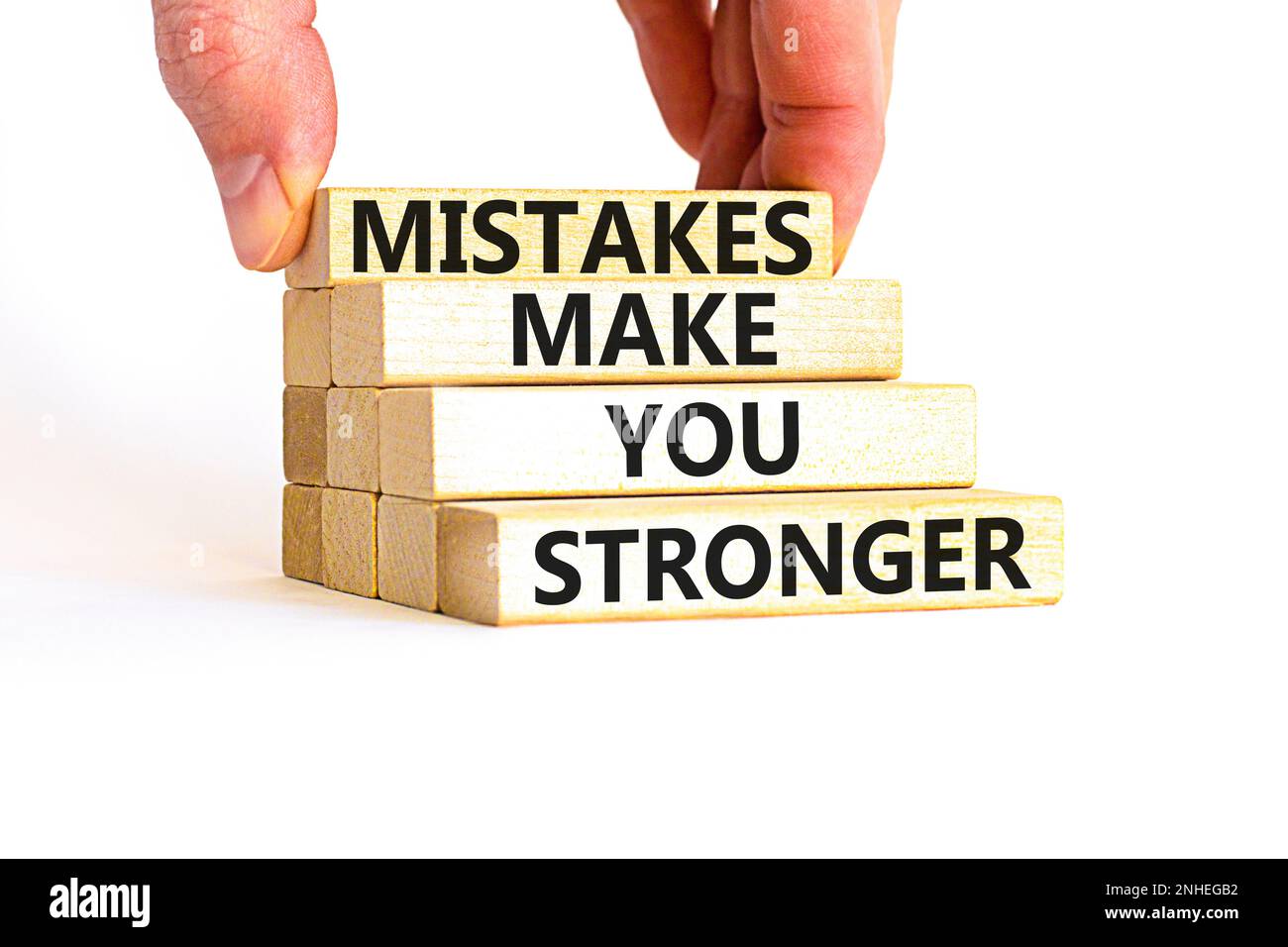 Mistake make stronger symbol. Concept words Mistakes make you stronger on wooden blocks ...