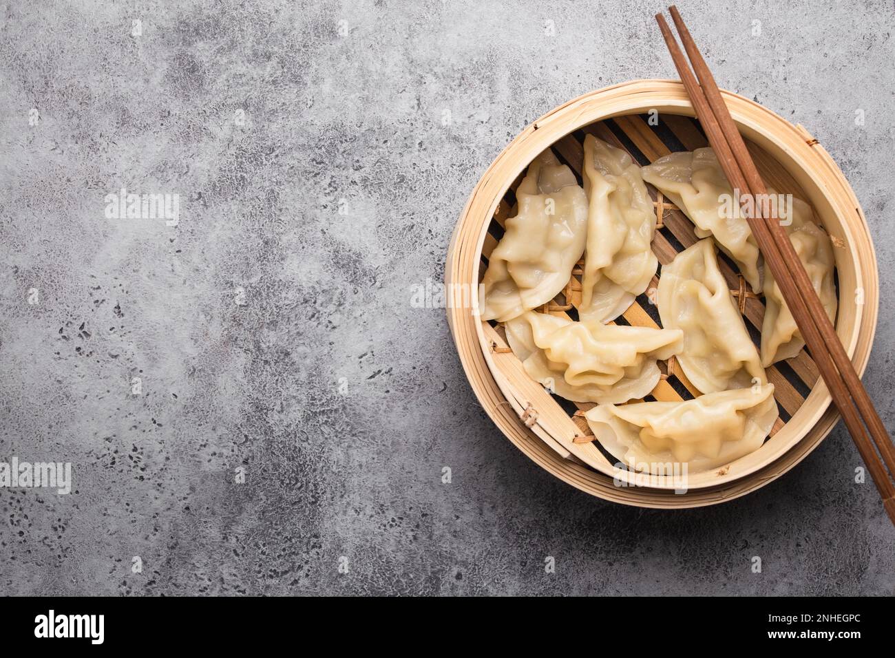 Close-up, top view of traditional Asian dumplings in bamboo steamer ...