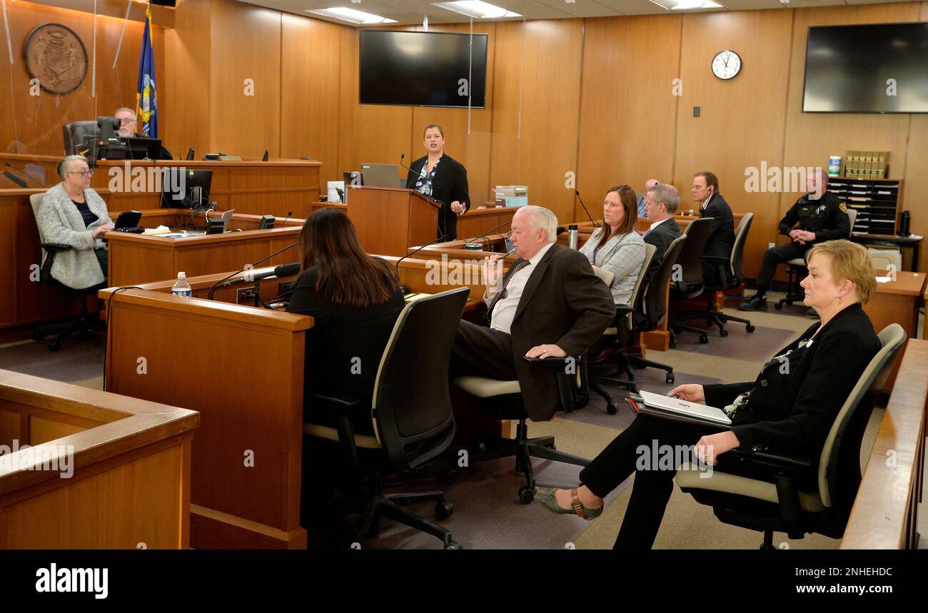 Mackenzie Renner, one of Mark Jensen's attorney's, center back, gives ...