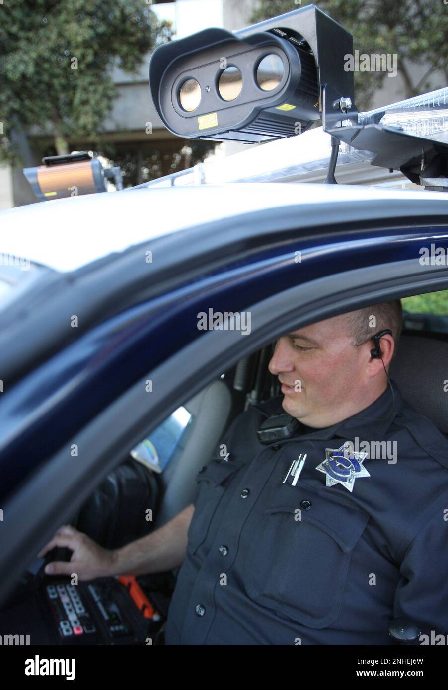 licenseplates 011 mac.jpg San Jose Police Officer Max Boyer inside his ...